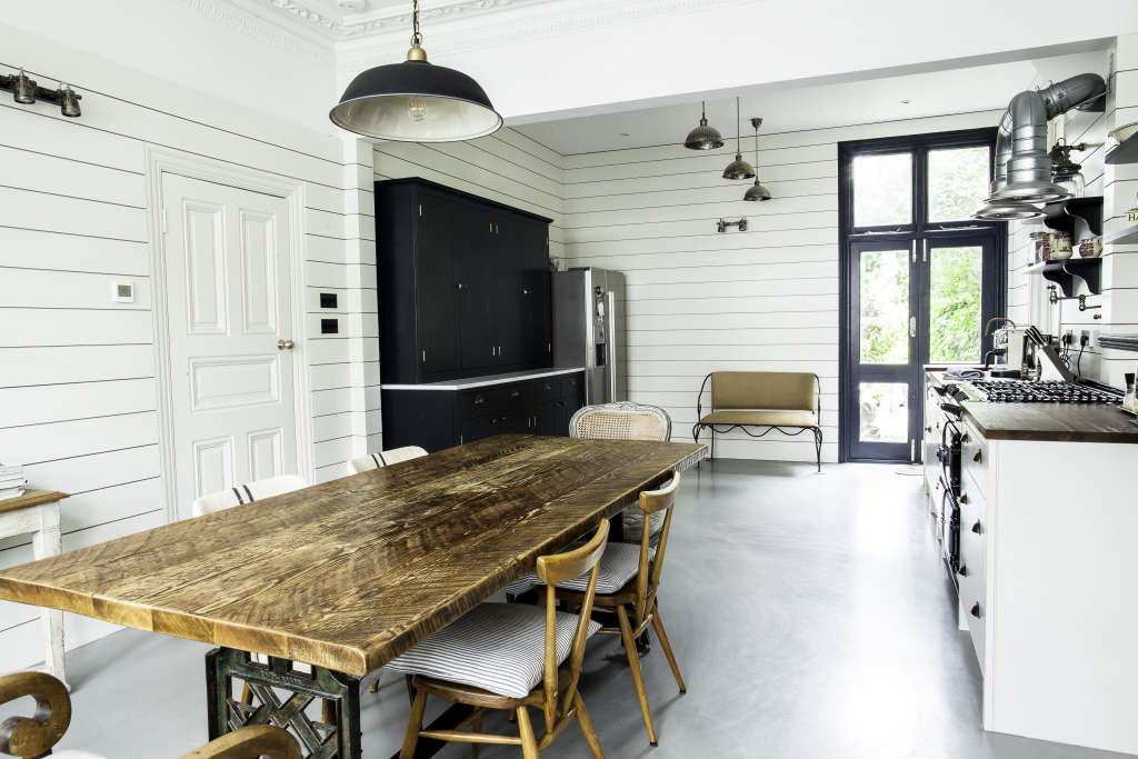 Shiplap wood paneling in a classic English kitchen remodel