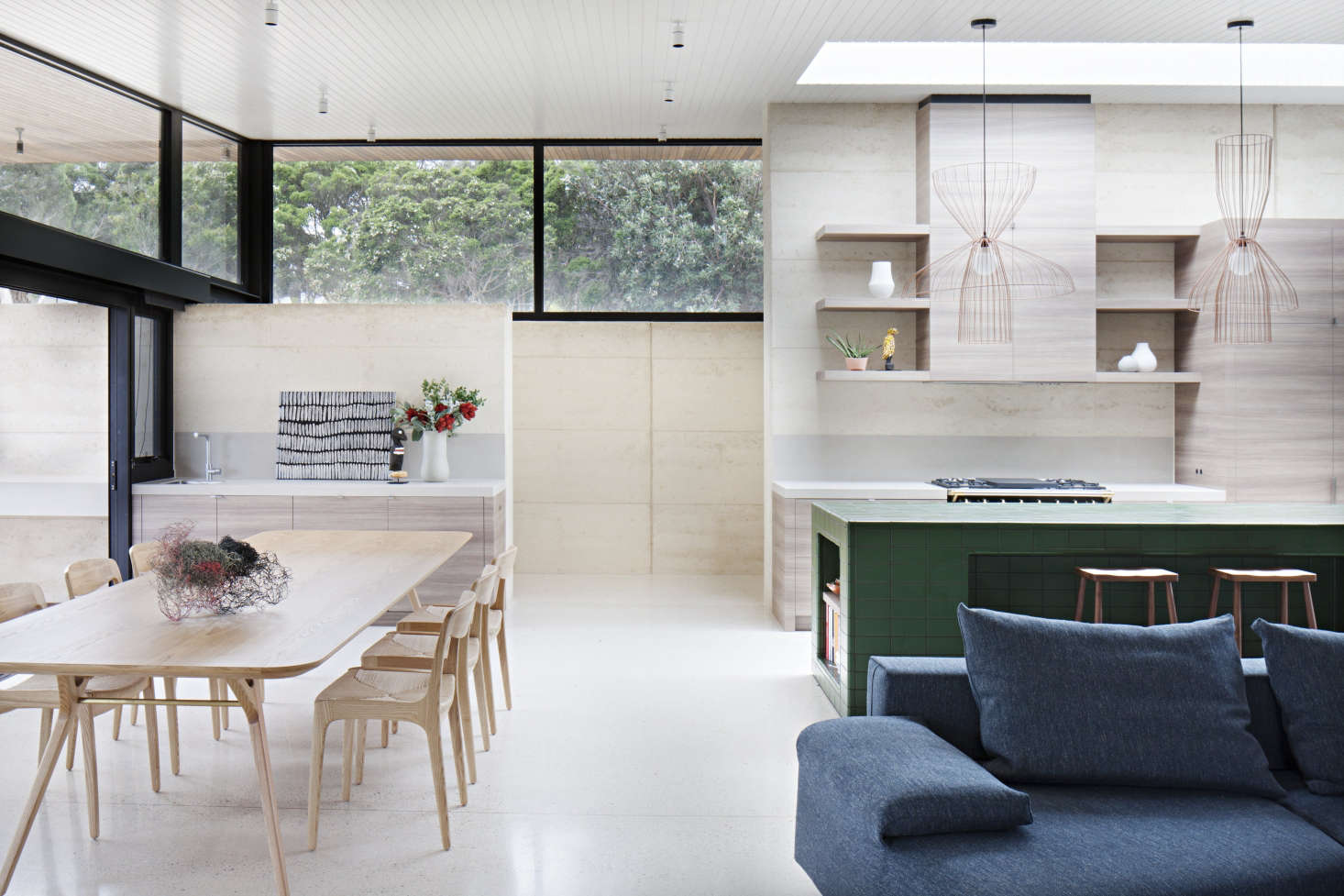 Tiled kitchen island in contemporary wood kitchen at Layer House by ...