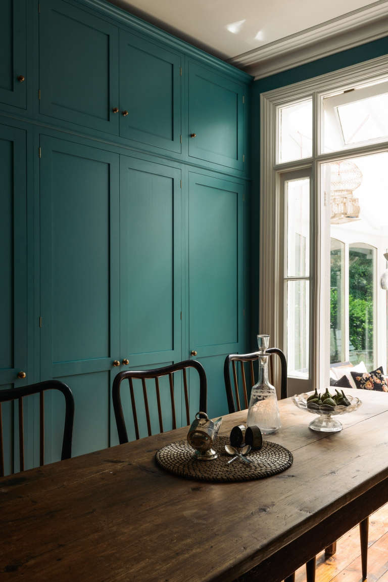Shaker-style deVol kitchen in London with statement tiled backsplash