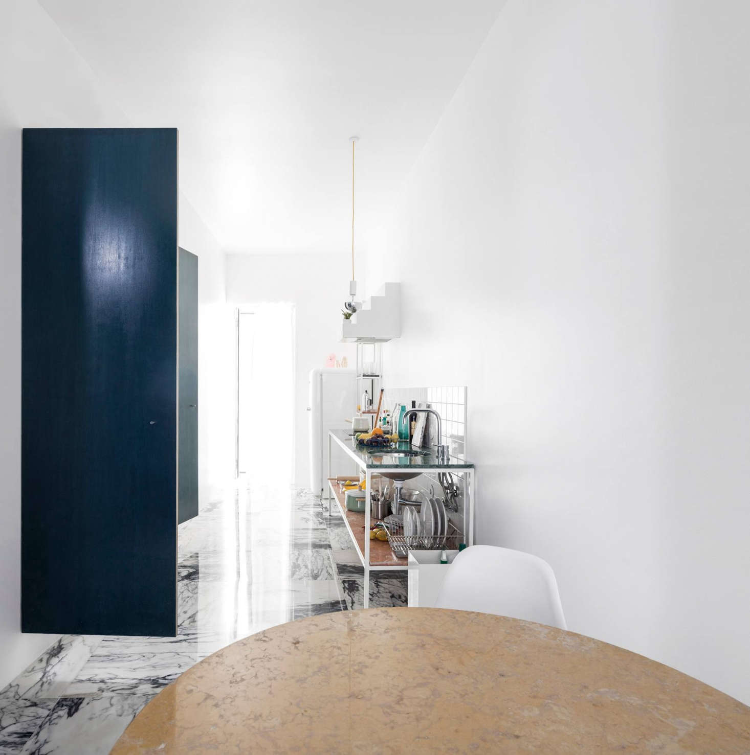 In Lisbon, a Narrow but Glamorous Marble-Clad Apartment - Remodelista