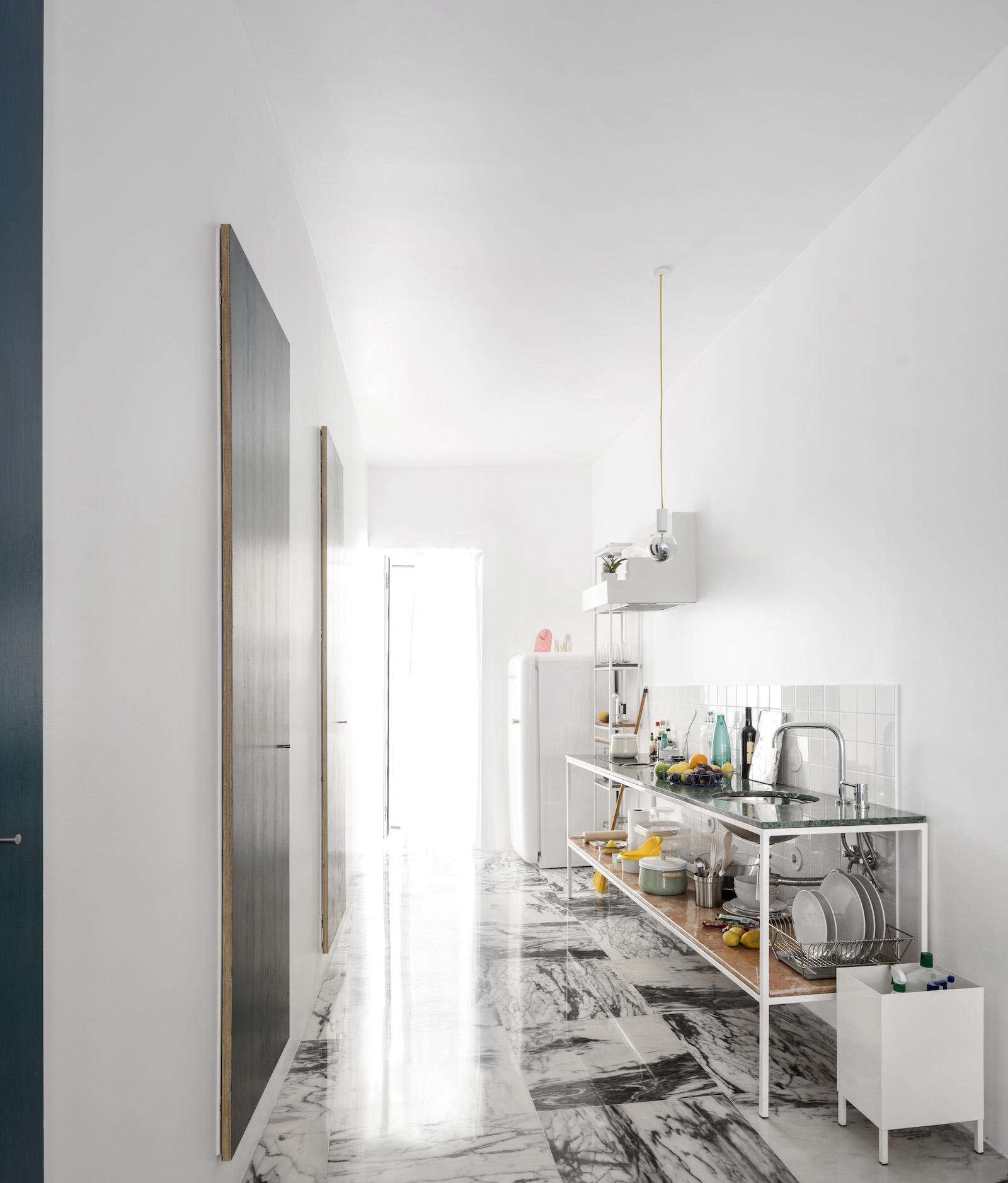 In Lisbon, a Narrow but Glamorous Marble-Clad Apartment - Remodelista