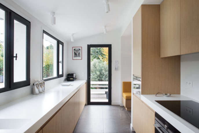 minimalist-long-narrow-paris-kitchen-with-indoor-outdoor-dining-areas ...