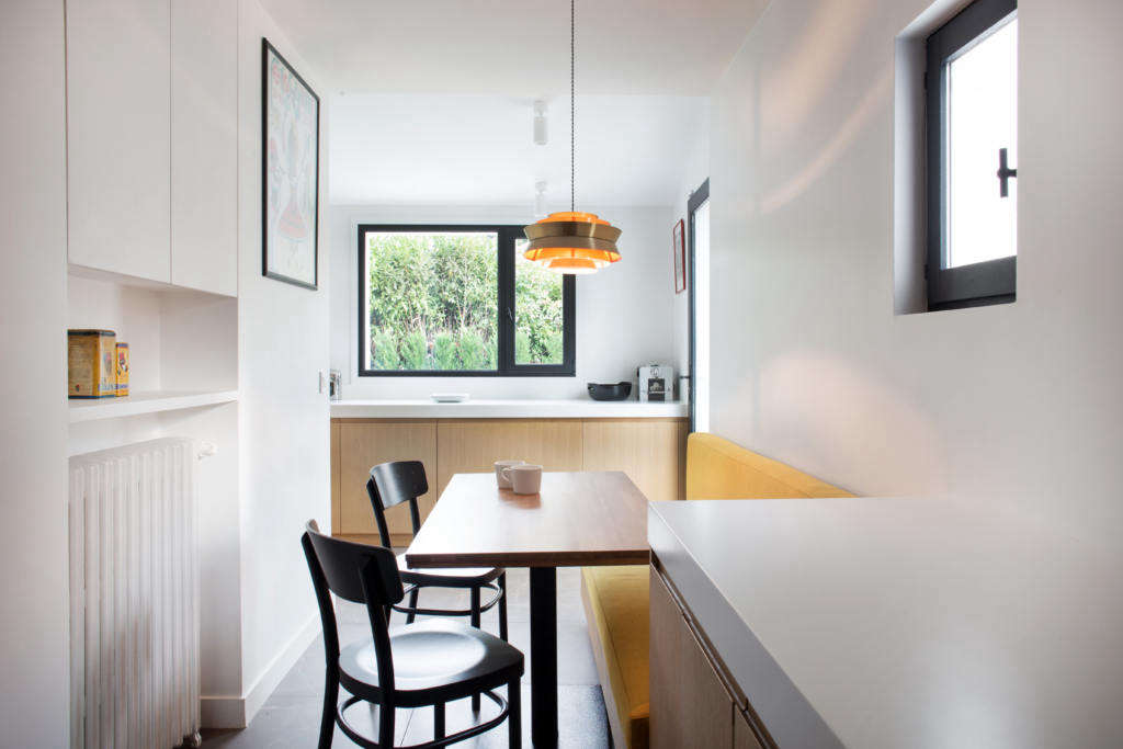 minimalist-long-narrow-paris-kitchen-with-indoor-outdoor-dining-areas ...