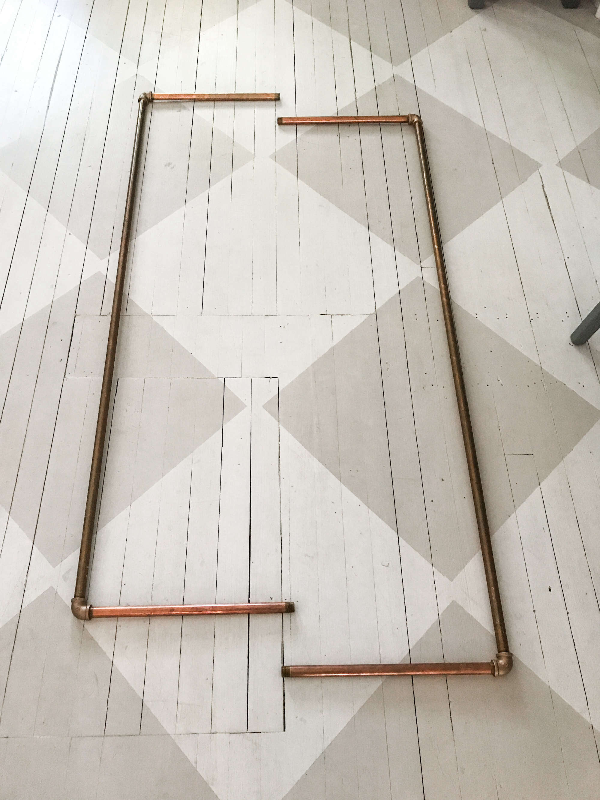 A DIY Shower Curtain Hoop Made from Brass Pipes, by Zio & Sons