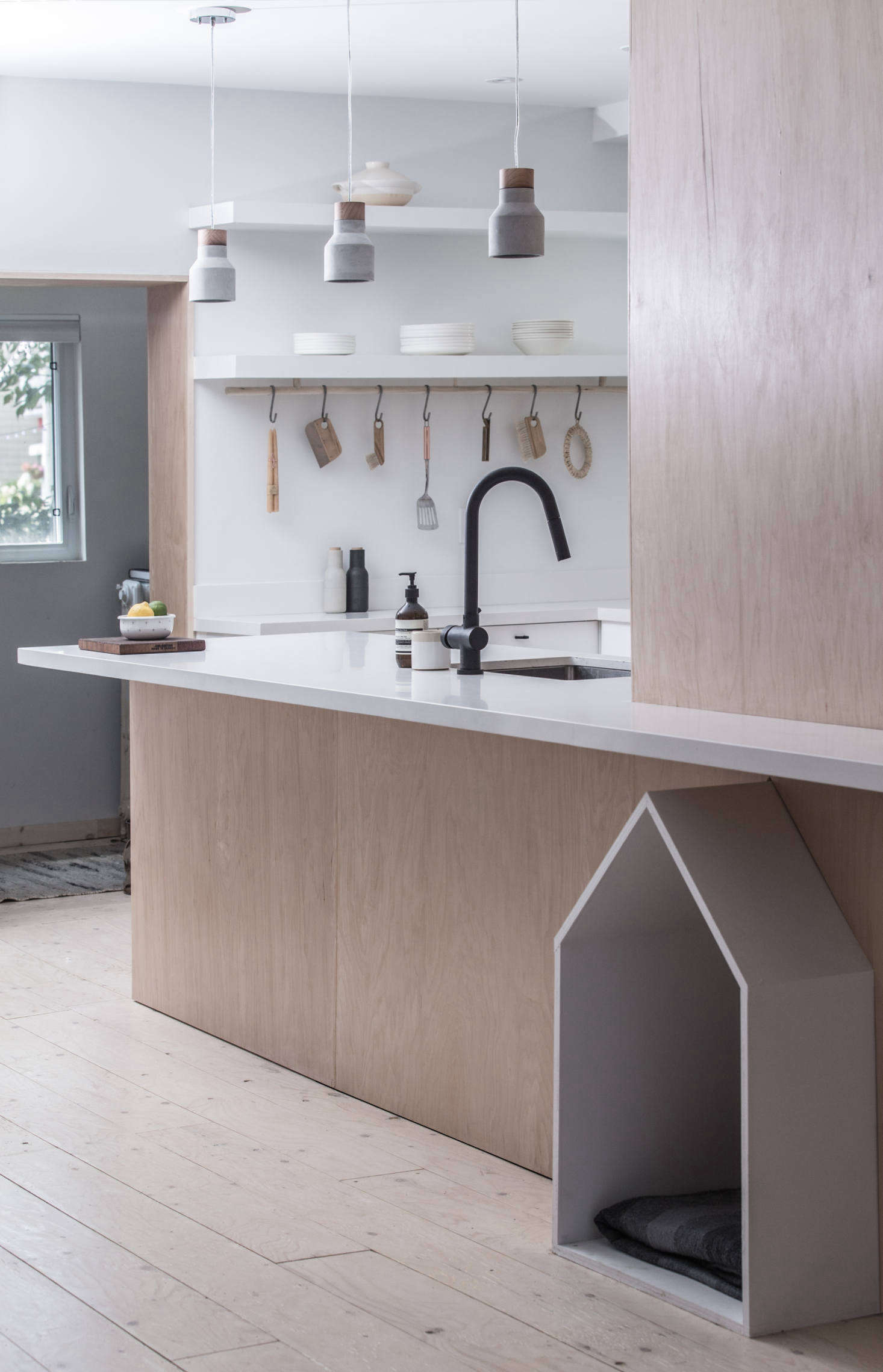 An Open Kitchen Design with a Built-In Dog House, Ikea Cabinets, Too