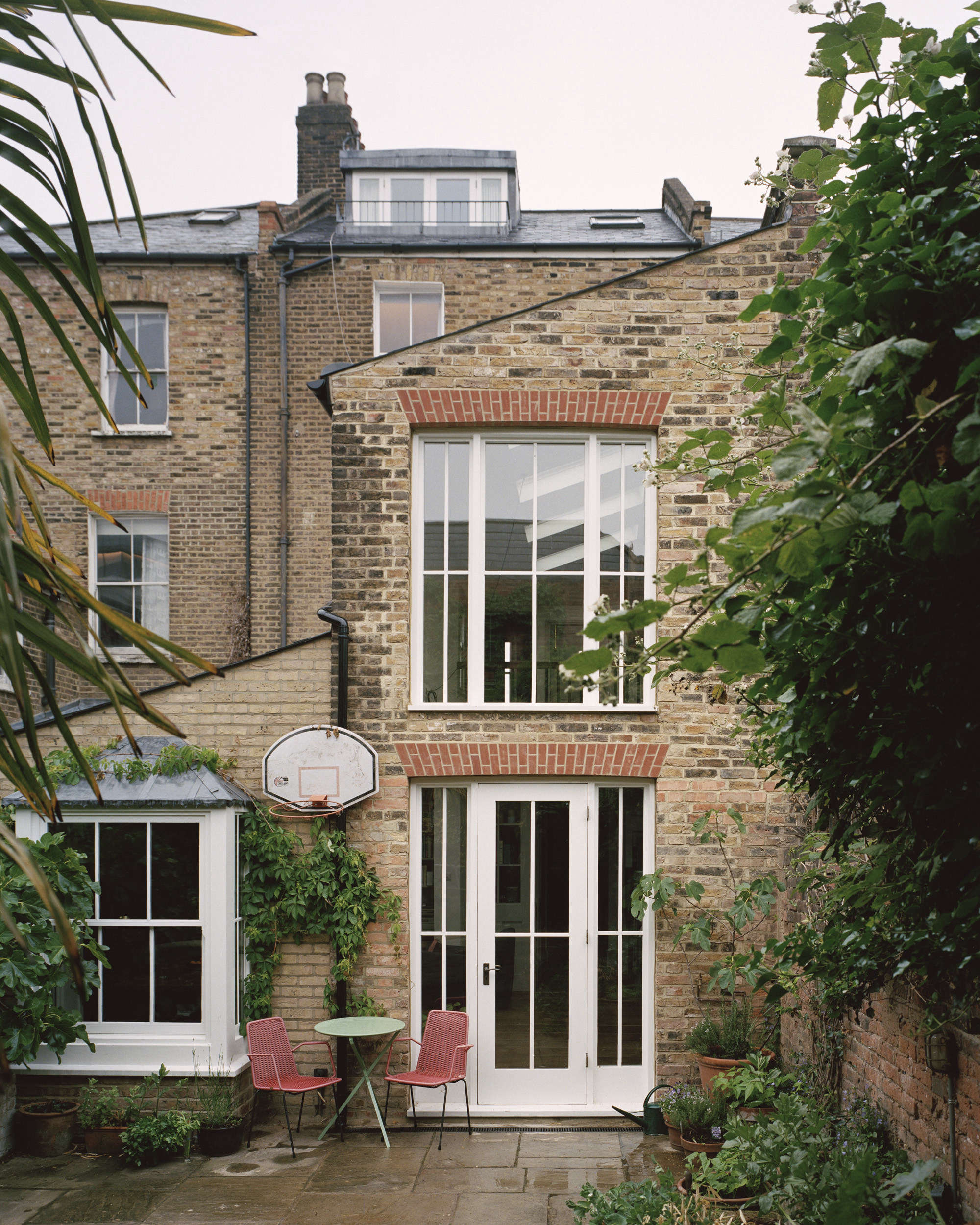 Victorian row house updated as lofty duplex by interior design Mark Lewis