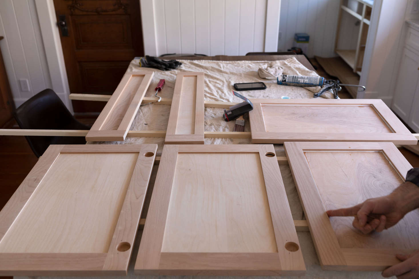 How to Paint Kitchen Cabinets By Hand: DIY Tips from Two Experts