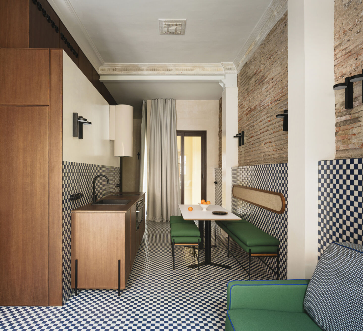 Checkerboard tile patterns a historic house remodel in Spain by Viruta Lab