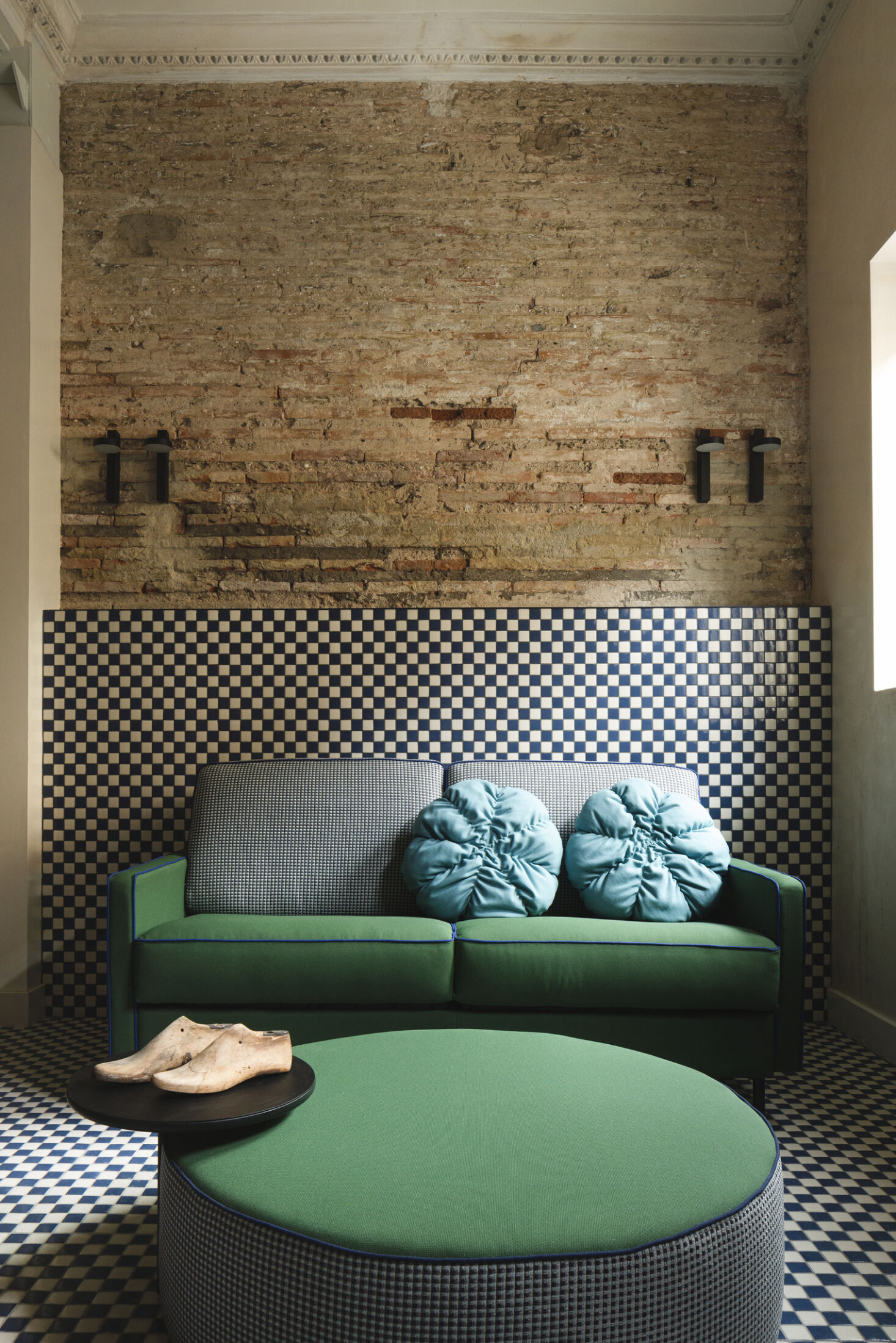 Checkerboard tile patterns a historic house remodel in Spain by Viruta Lab