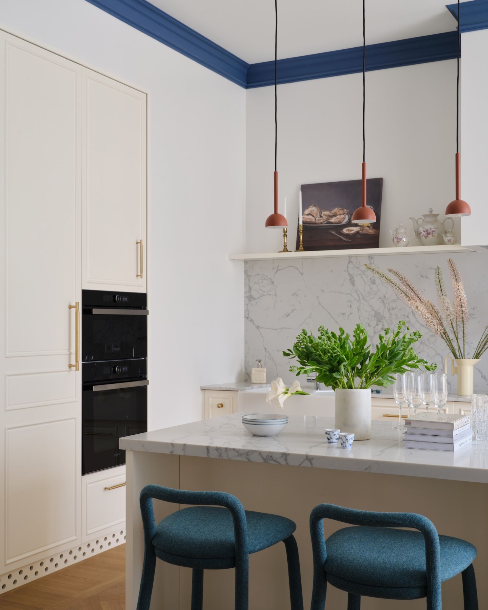 Blue-accented kitchen by Fariz Mamedov in Almaty, Kazakhstan